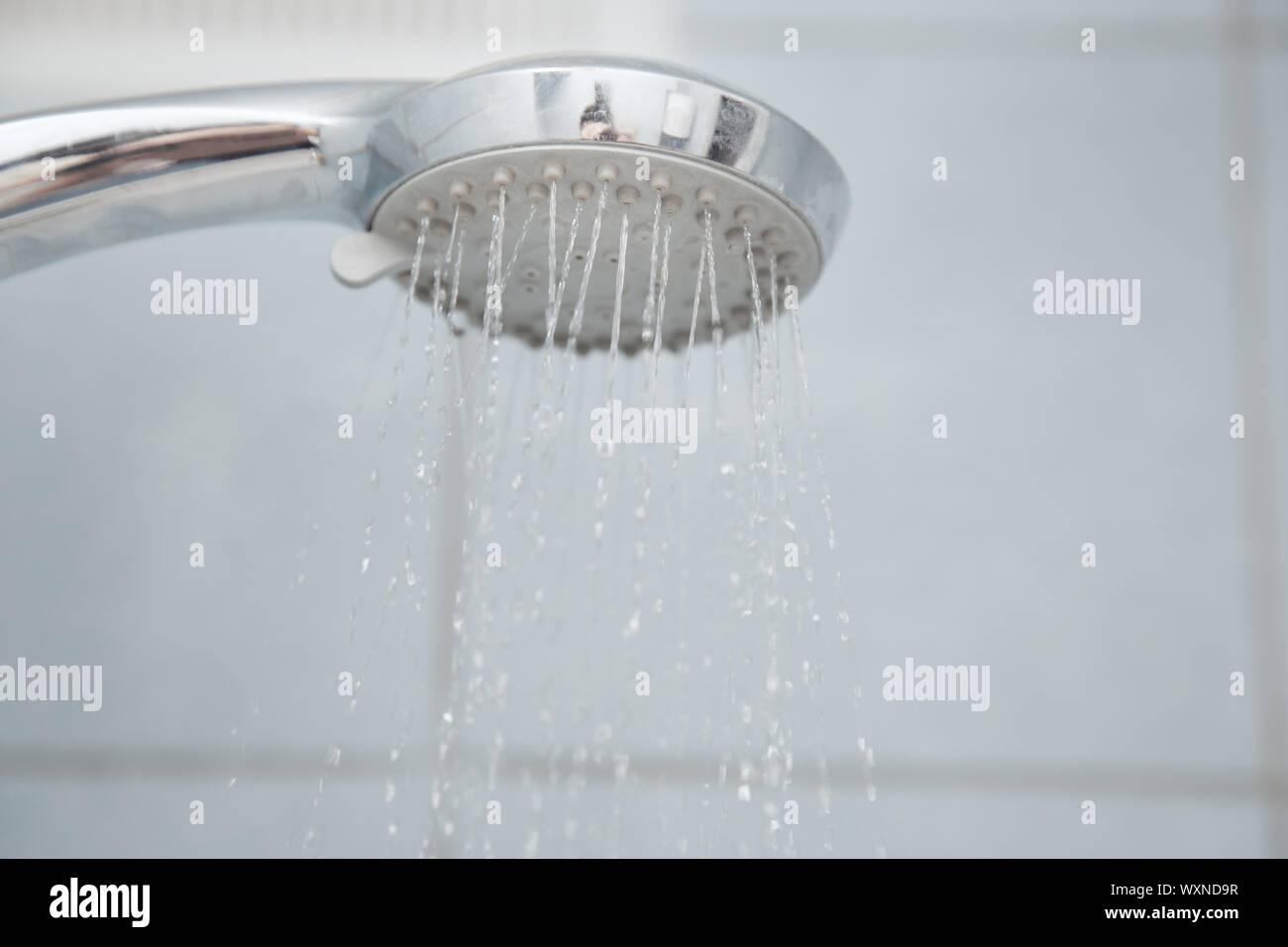 Shower in bathroom with water flowing Stock Photo - Alamy