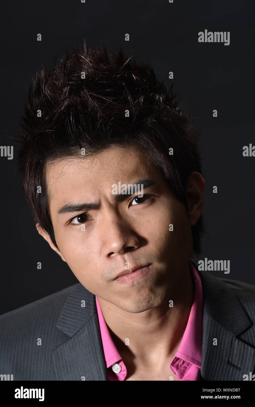 Angry young business man, closeup portrait on face Stock Photo - Alamy