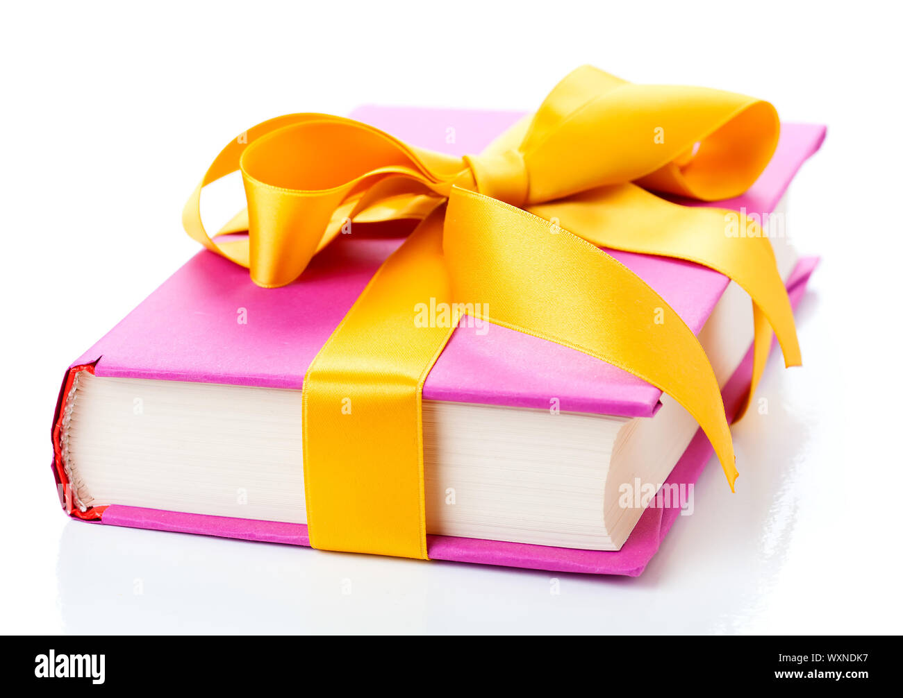 The book with a bow on a white background Stock Photo - Alamy