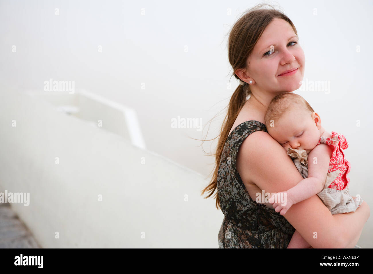 Young mother and her baby girl outdoors at windy day Stock Photo - Alamy
