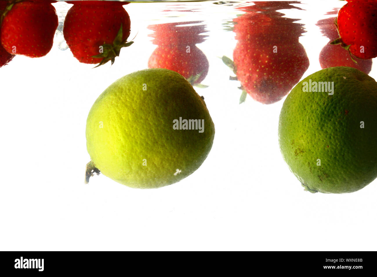 lime splash isolated on white background Stock Photo - Alamy