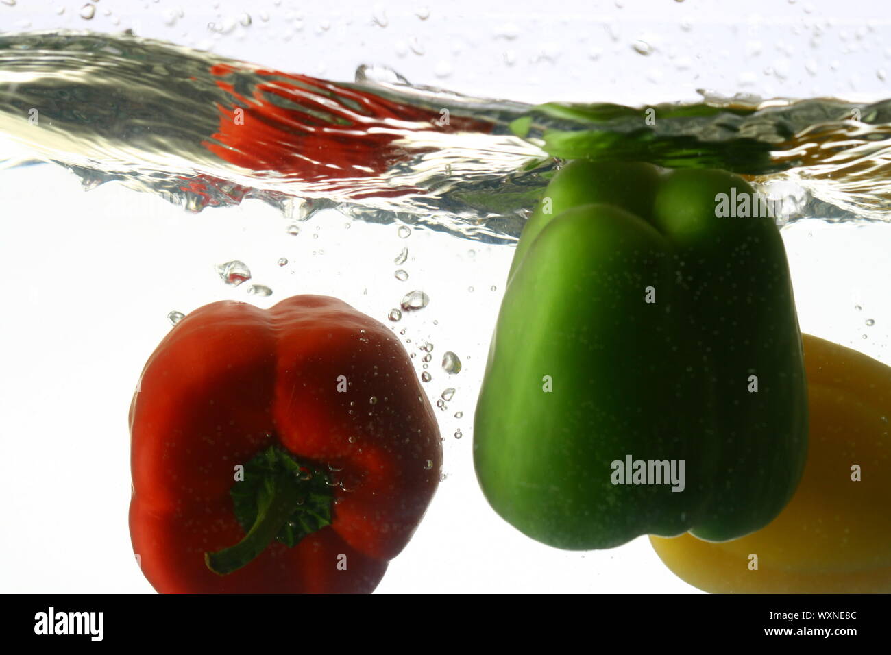 paprica splash in water isolated on white background Stock Photo - Alamy