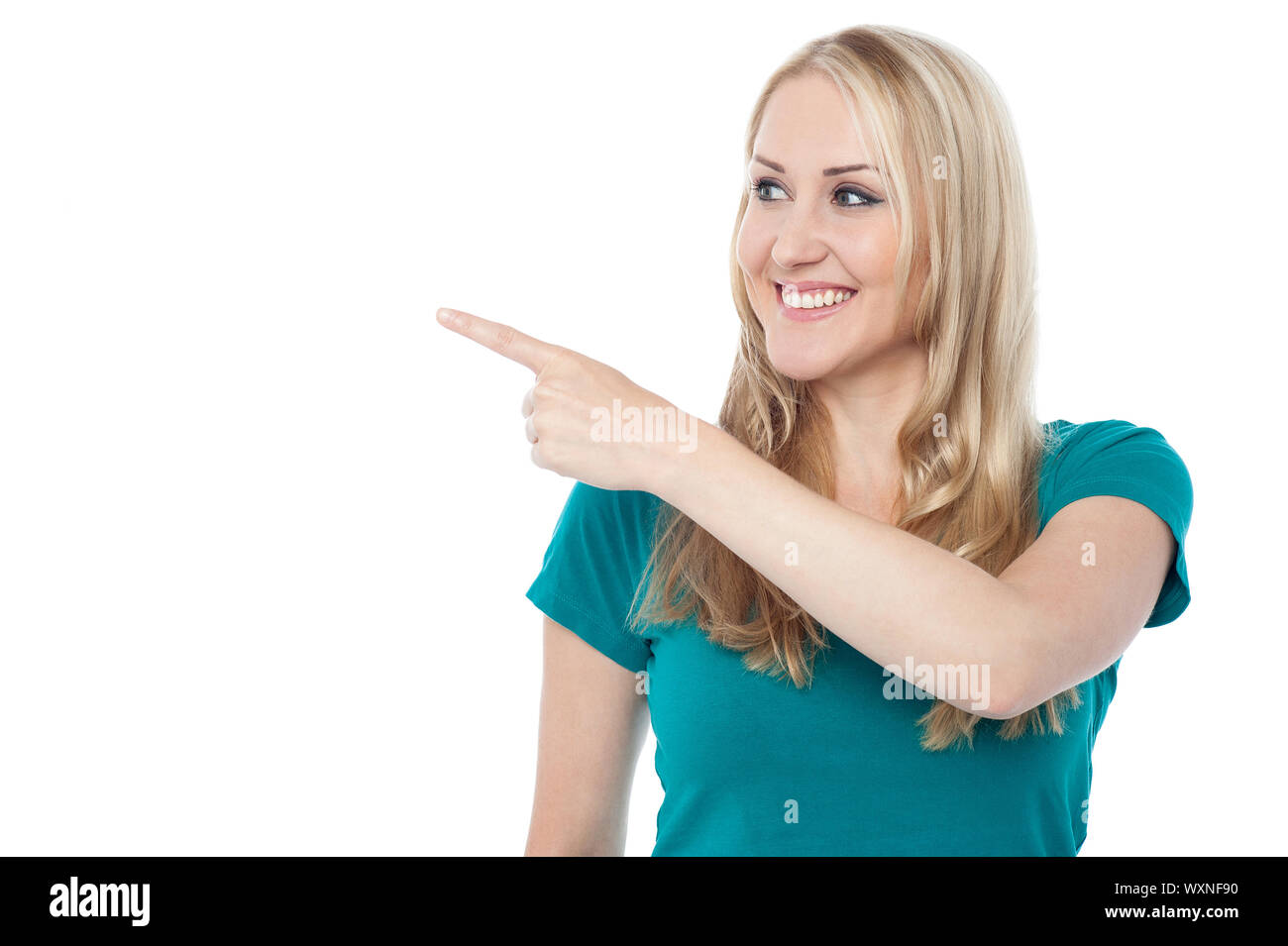 Charming woman pointing towards right Stock Photo - Alamy
