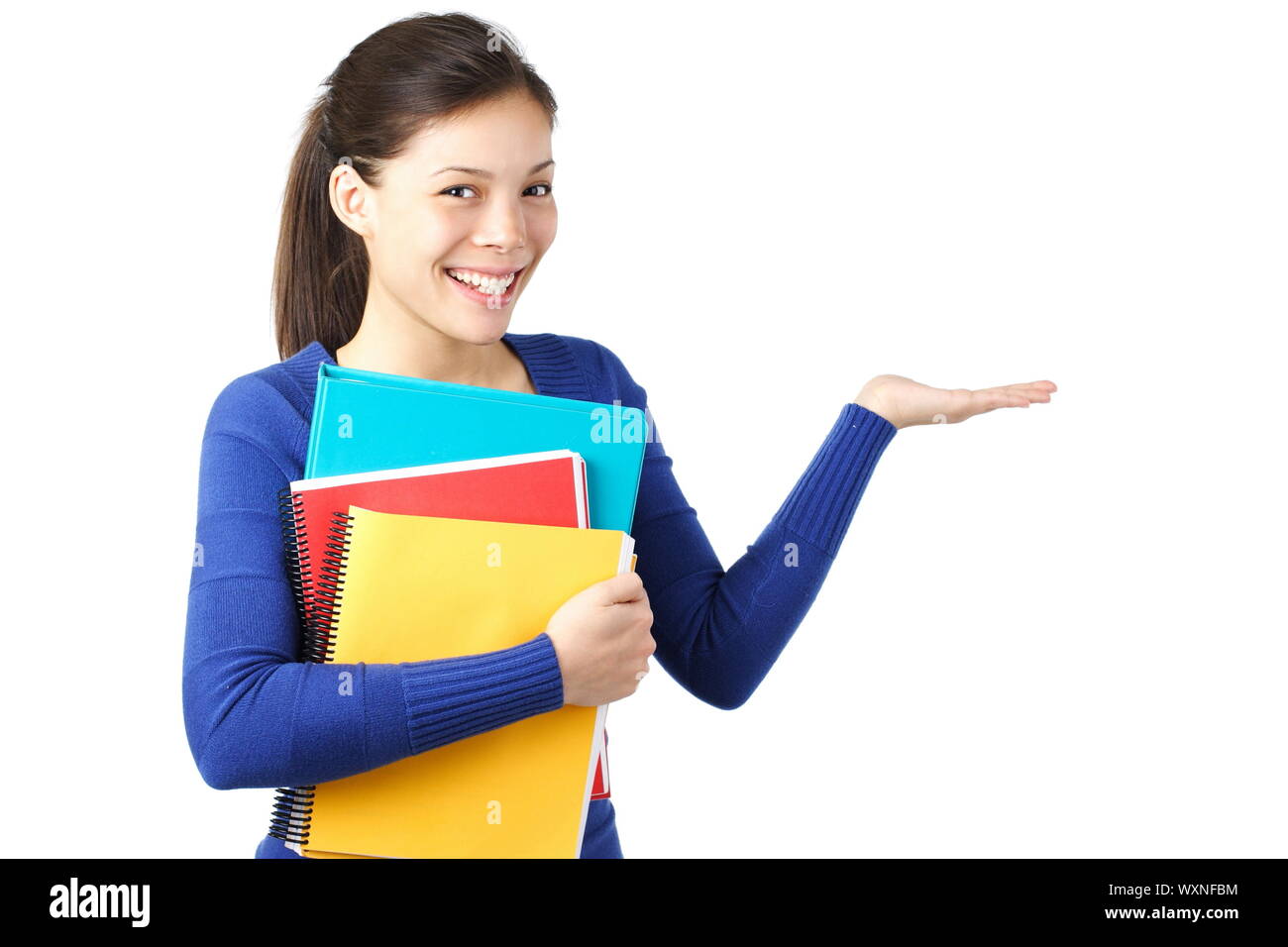 University student holding / presenting something in her hand. Isolated ...