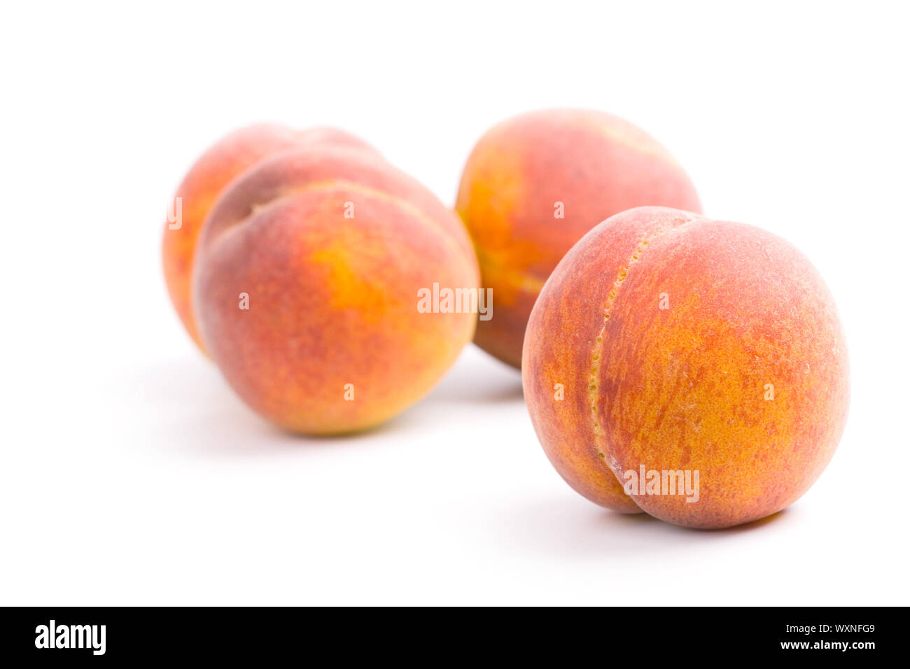 Four peaches on white hi-res stock photography and images - Alamy