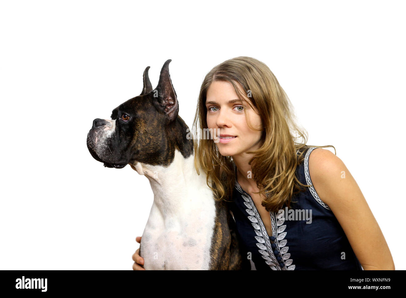 A young woman hugging her boxer dog Stock Photo - Alamy