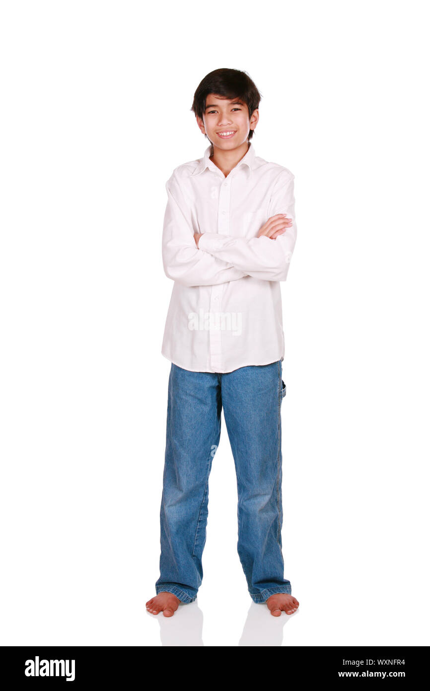 Twelve year old boy standing arms crossed Stock Photo - Alamy