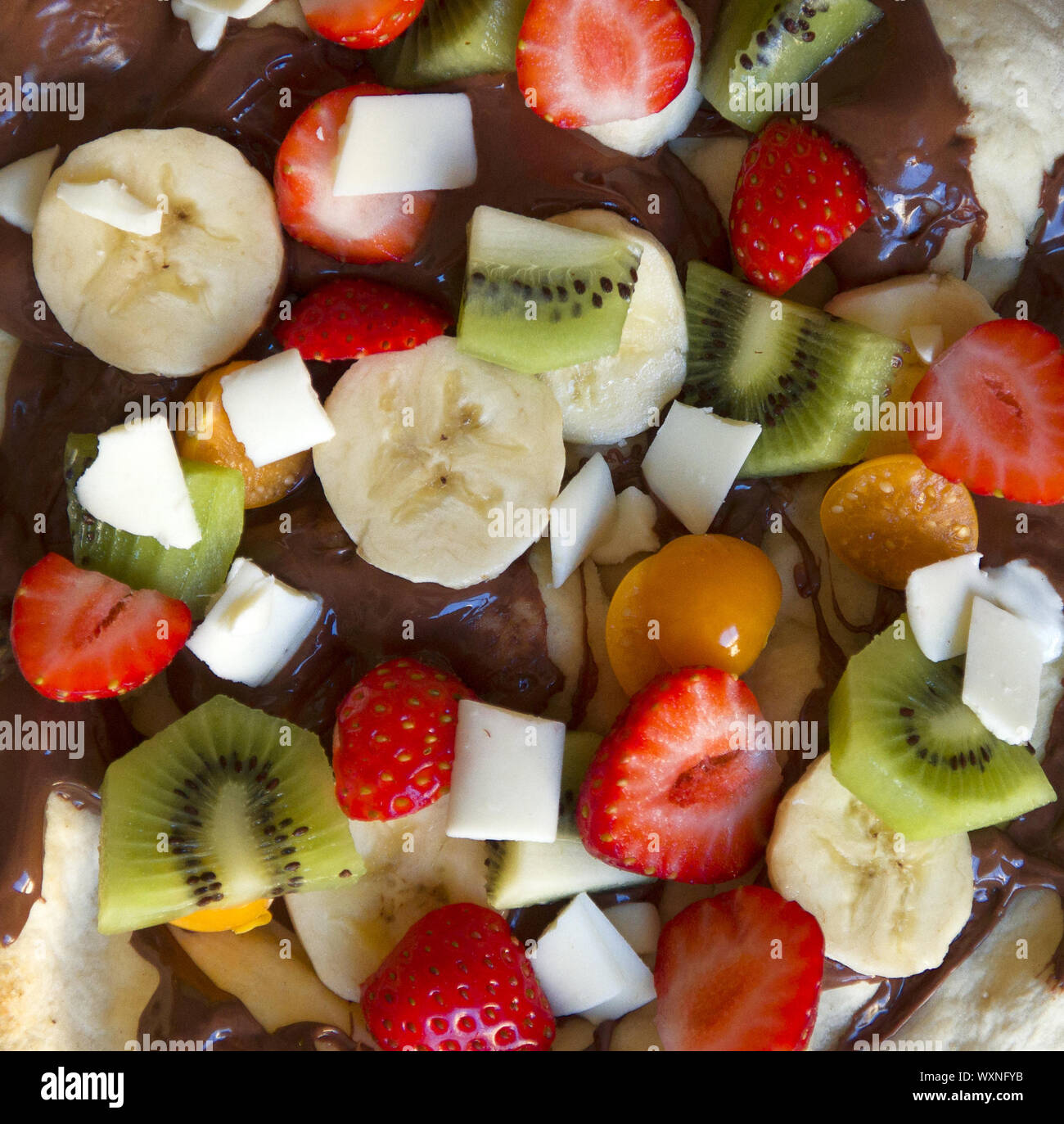 Sweet pizza made of fruits and chocolate spread Stock Photo - Alamy