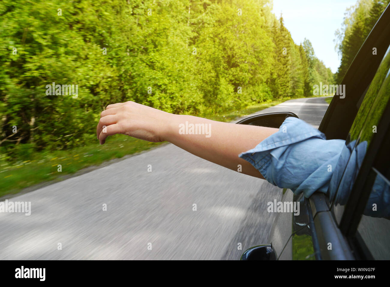 Woman's hand outside car window. Summer vacations concept Stock Photo ...