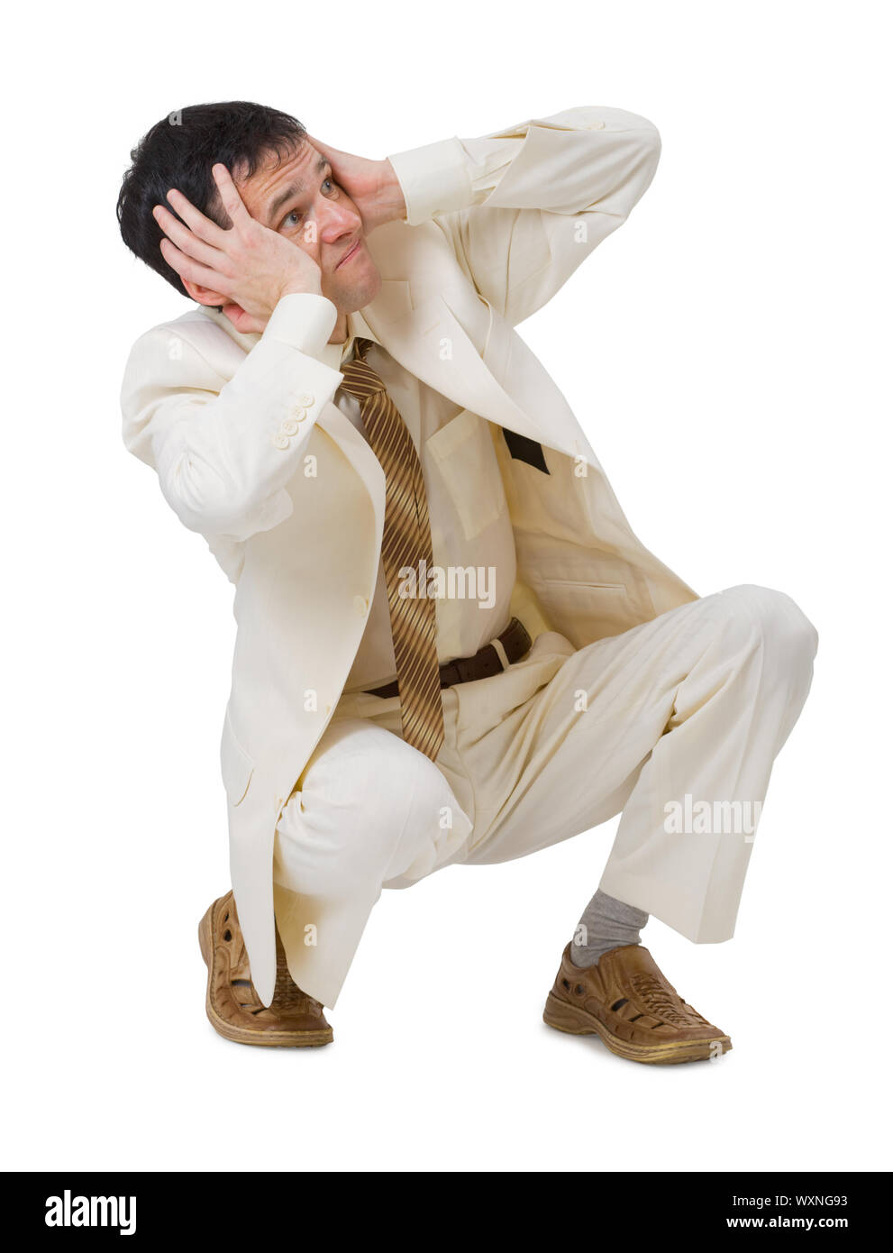 The frightened young man sits on a white background Stock Photo - Alamy