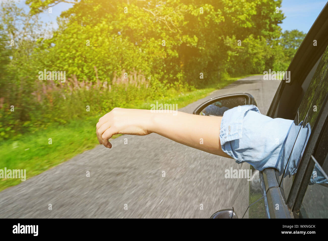 Woman's hand outside car window. Summer vacations concept Stock Photo ...