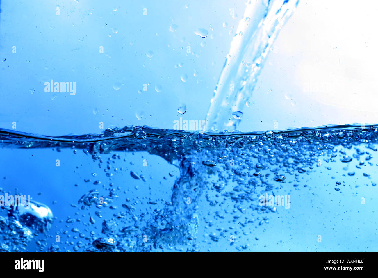 great blue water splash close up macro Stock Photo - Alamy
