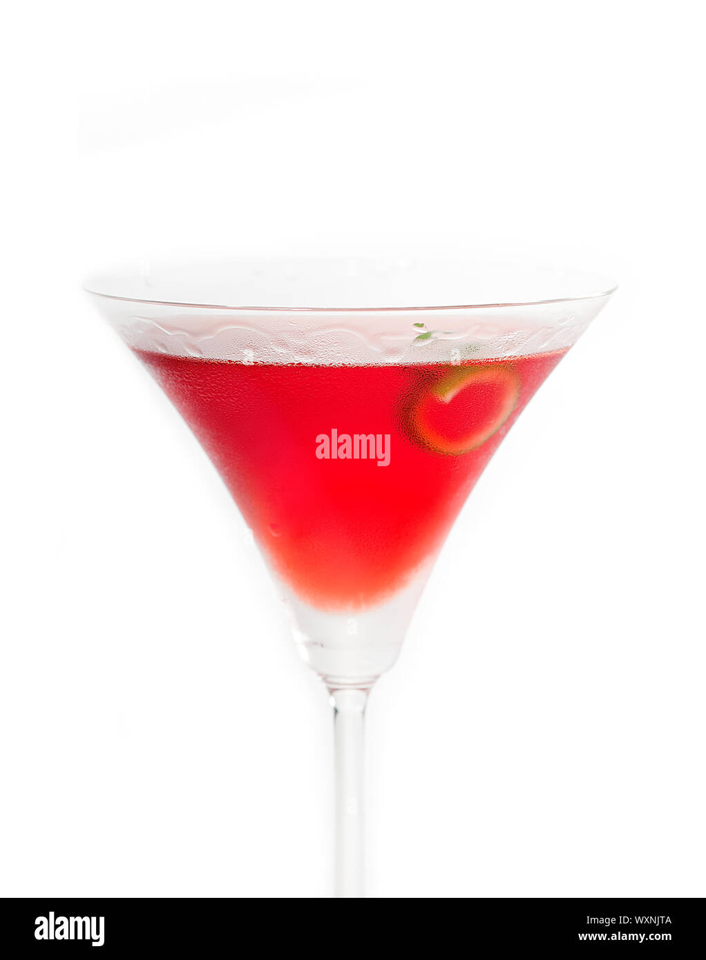 cosmopolitan drink cocktail straight up on martini cup with lime peel ...