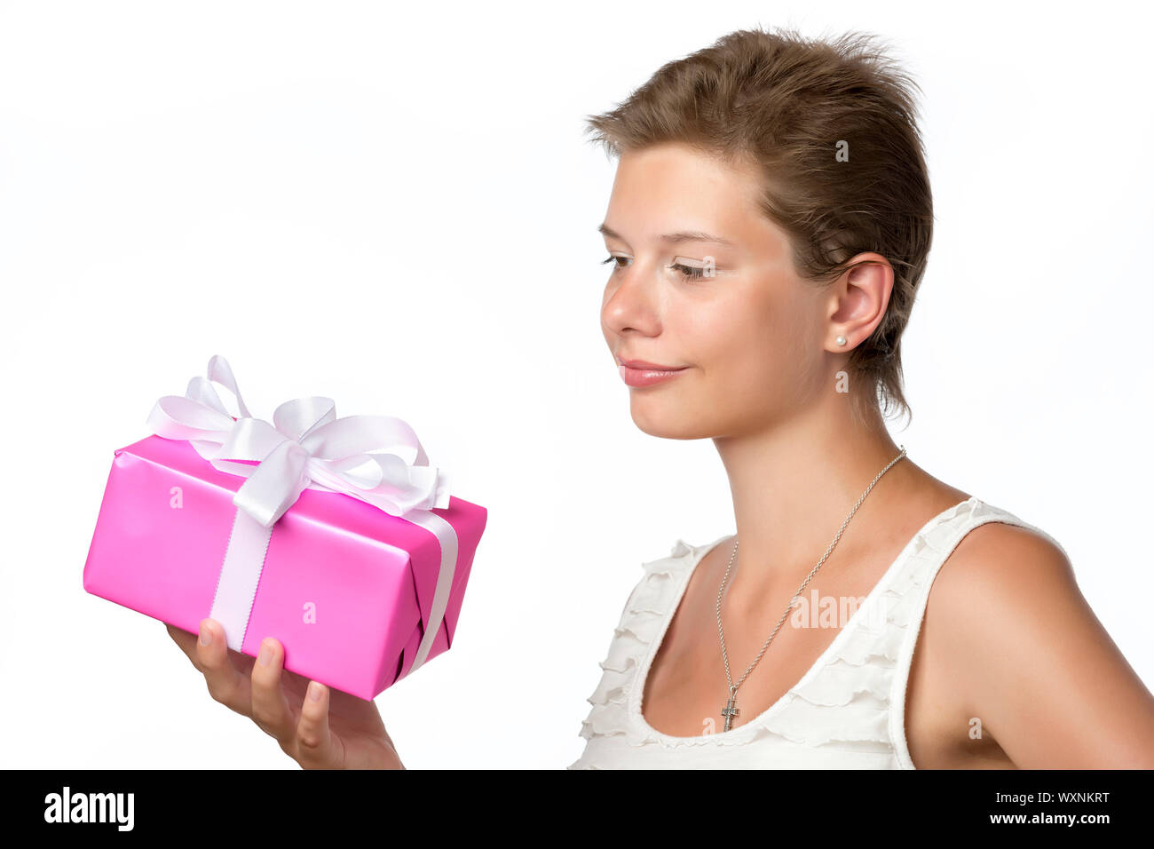 Young pretty woman with pink present in hands, isolated on white ...