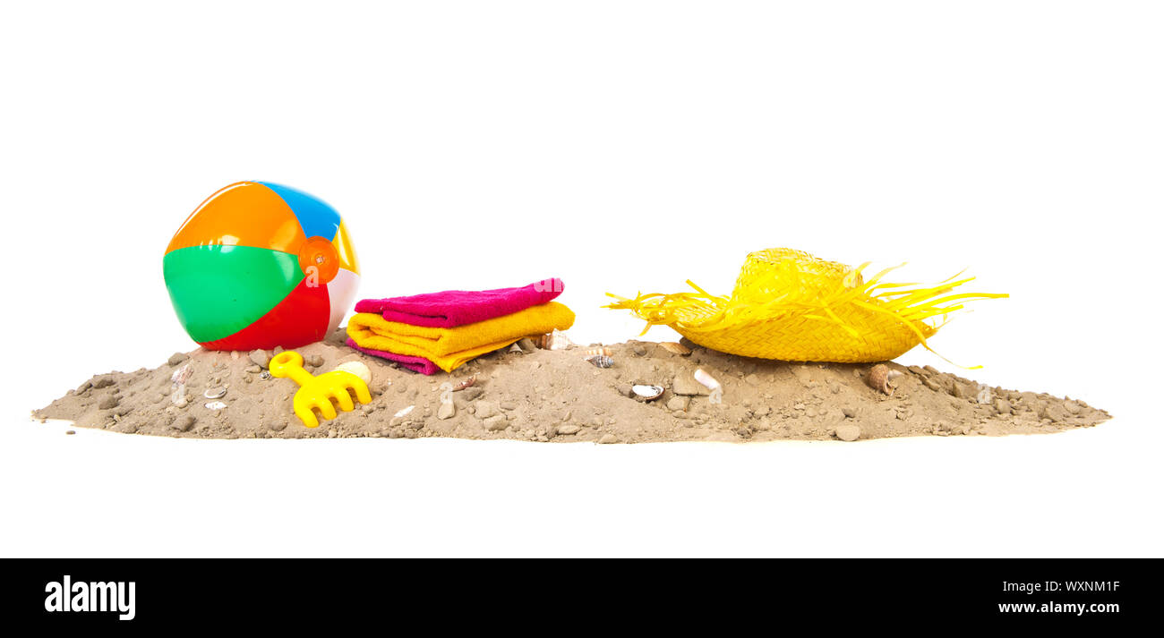 Beach ball with shells toys and towels isolated over white background ...
