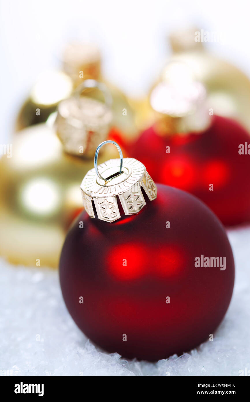 Christmas balls with snow on white background Stock Photo - Alamy