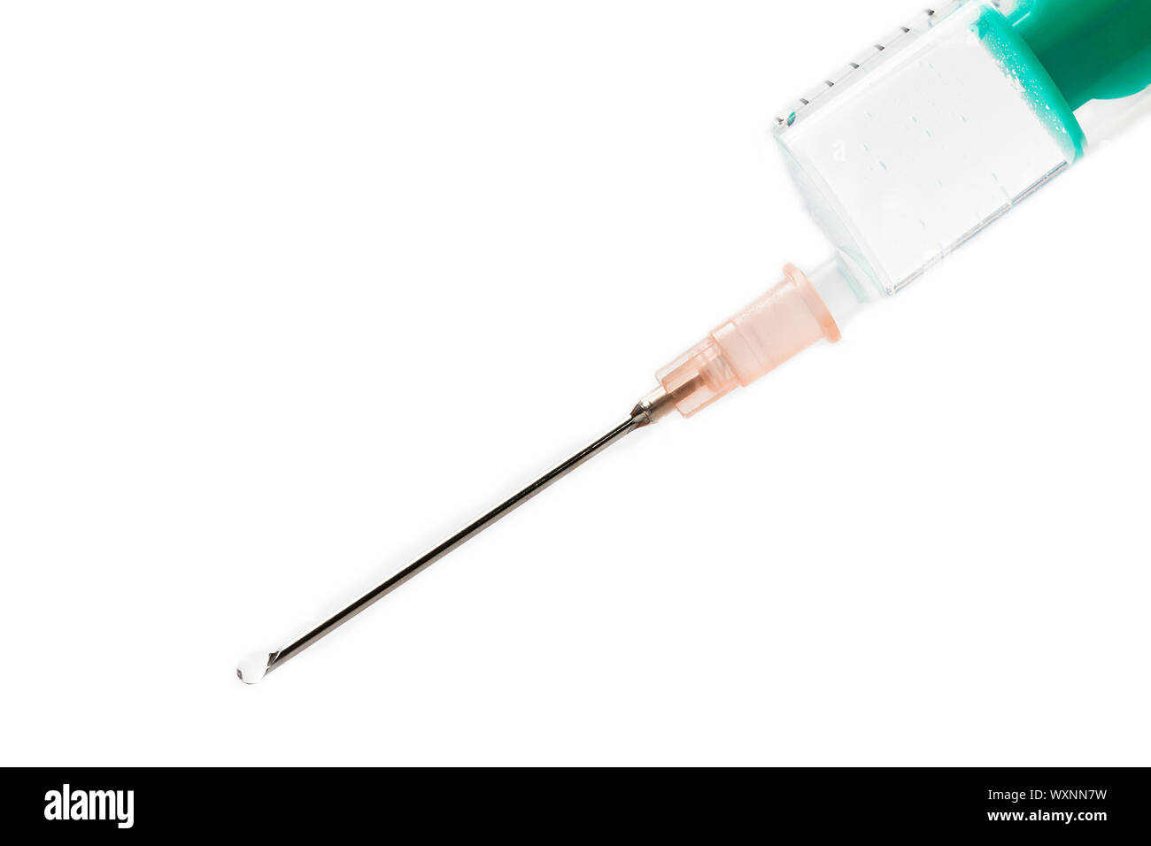 one syringe with water drop on white background Stock Photo - Alamy