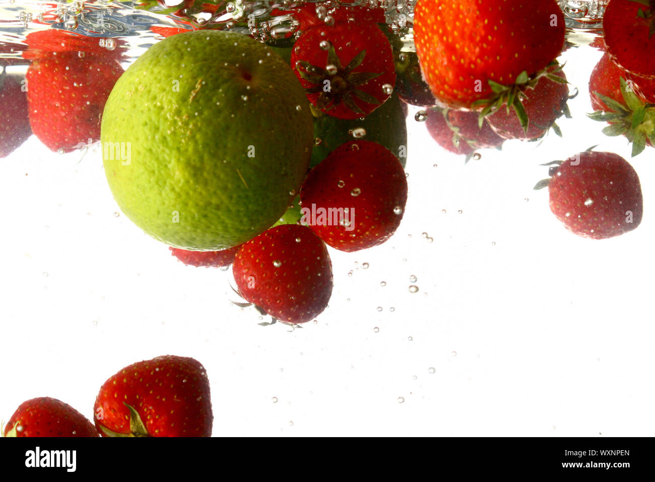 lime splash isolated on white background Stock Photo - Alamy