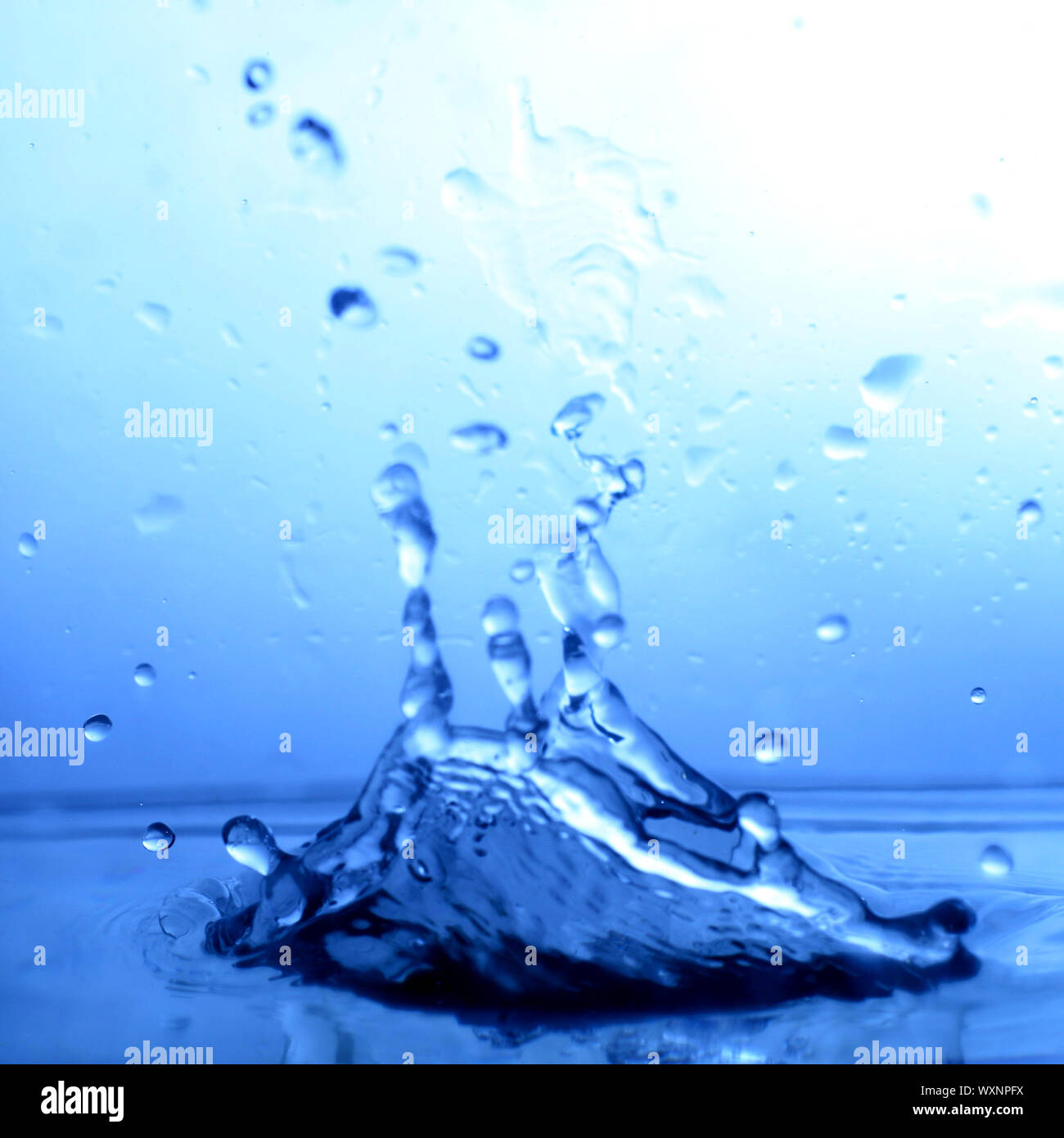 great blue water splash close up macro Stock Photo - Alamy