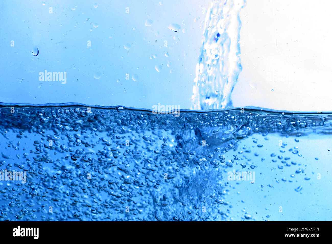 great blue water splash close up macro Stock Photo - Alamy