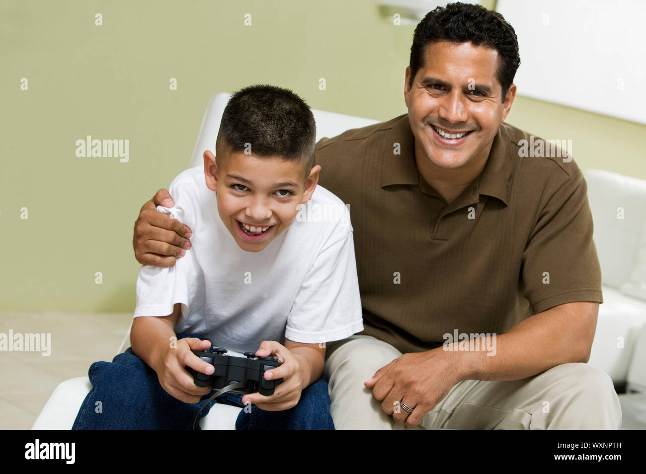 Father and Son Playing Video Game Stock Photo - Alamy