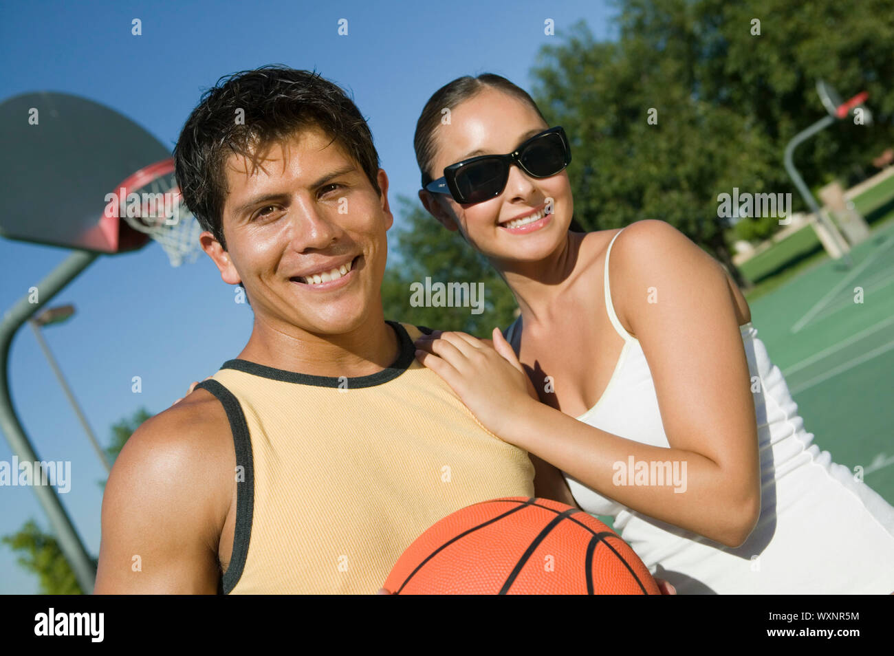 Couple at Basketball Court Stock Photo - Alamy