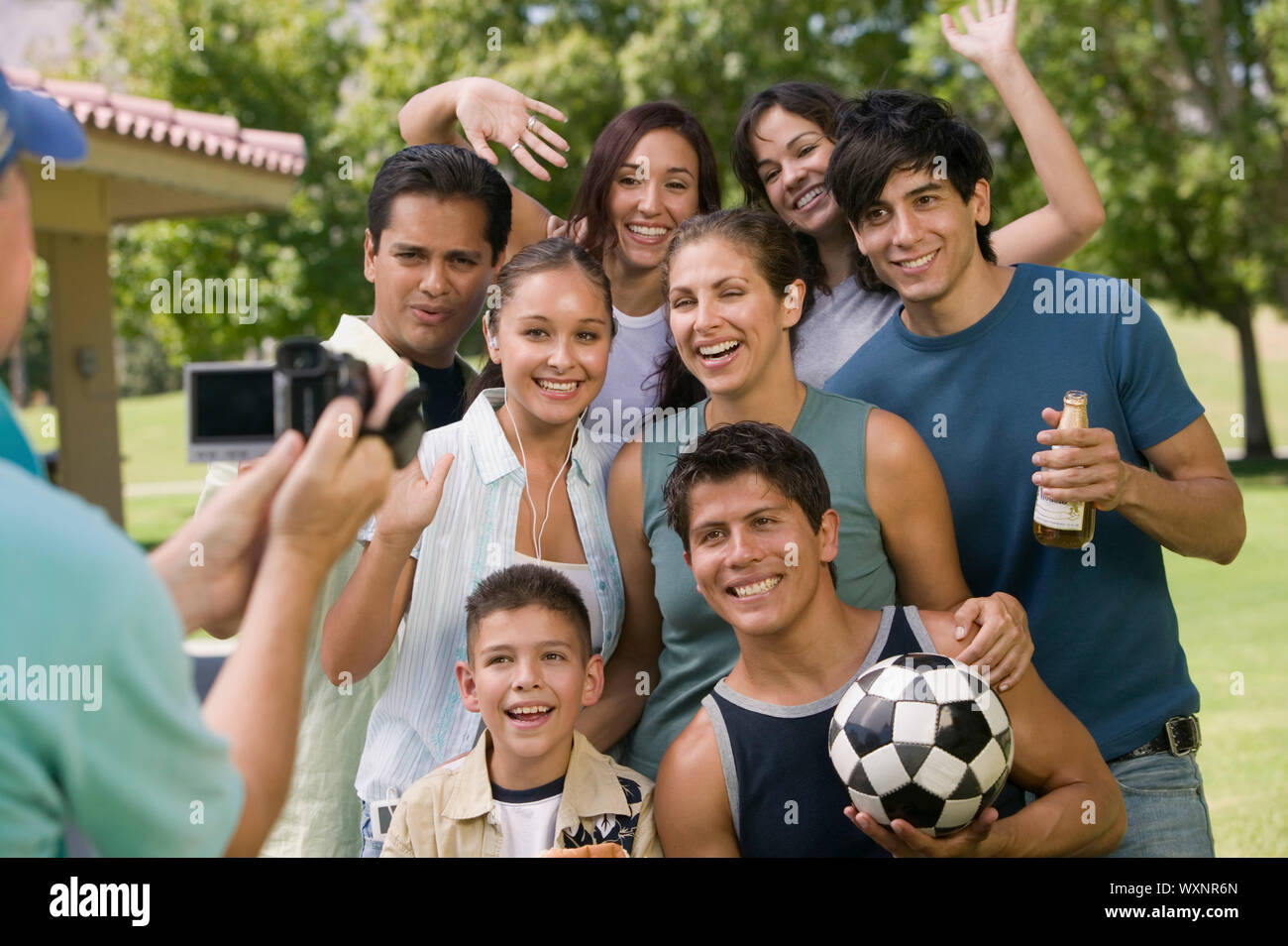 Group Posing for Video Camera Stock Photo - Alamy