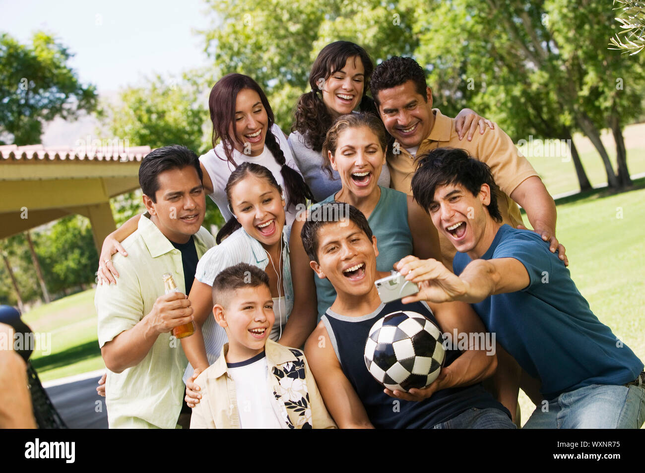 Group Posing for Digital Camera Stock Photo - Alamy