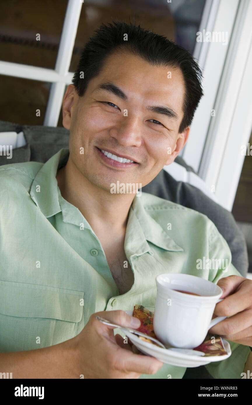 Smiling Man Drinking Coffee Stock Photo - Alamy