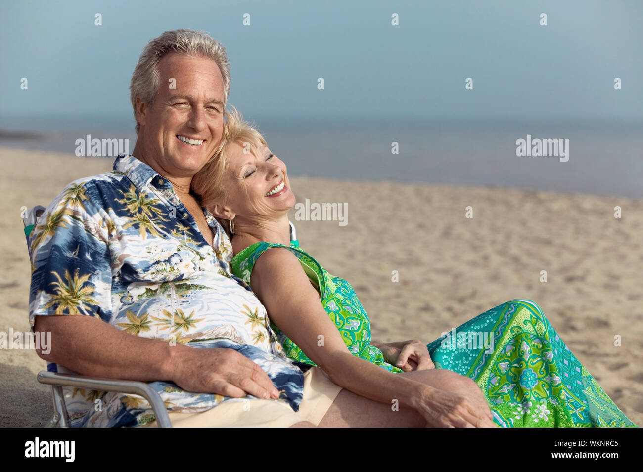 Woman reclining beach wearing hi-res stock photography and images - Alamy