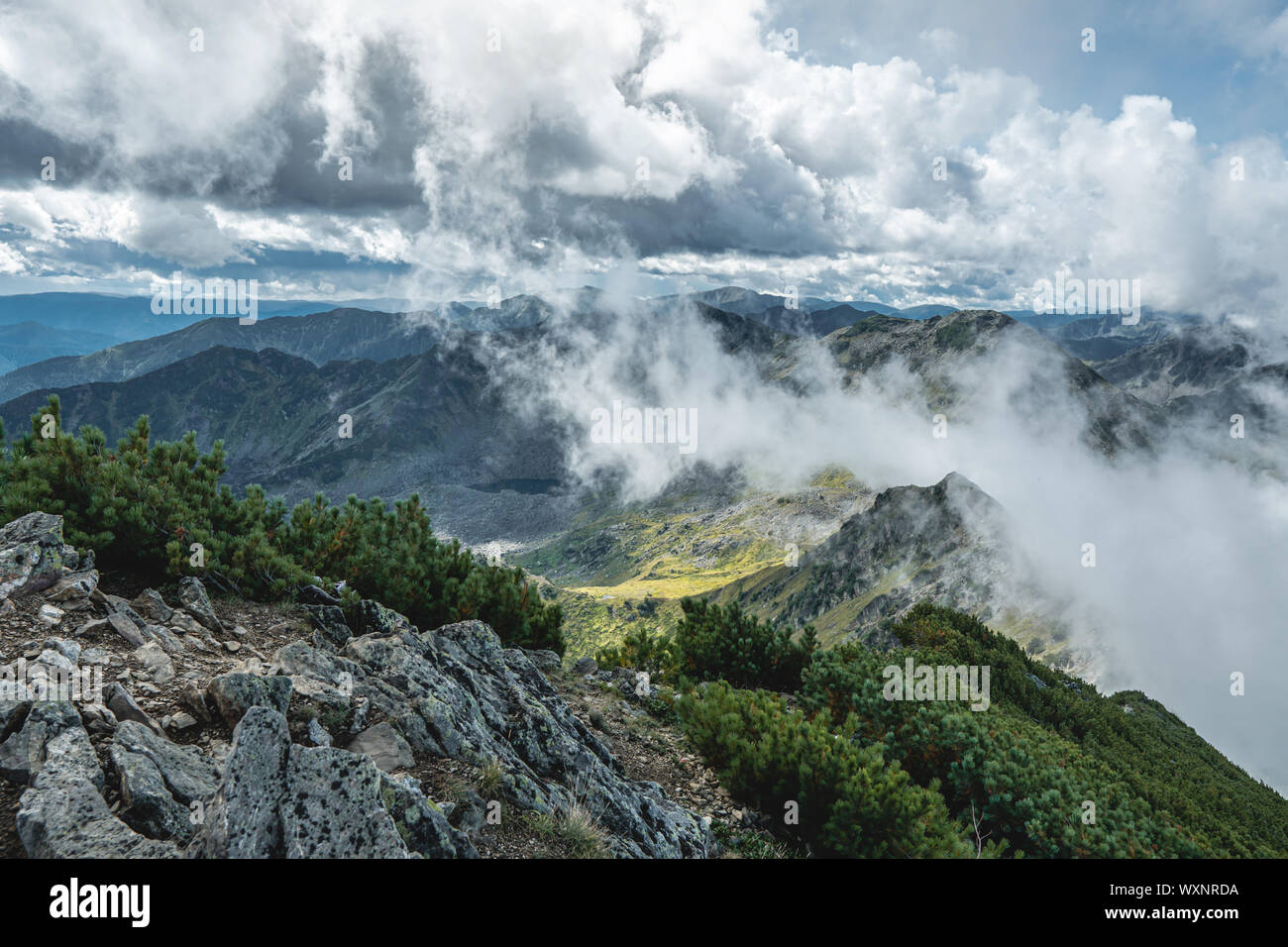 Beautiful view of the mountains from the peak. Landscape with clouds ...