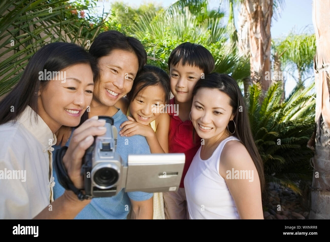 Asian family with kids look camera hi-res stock photography and images ...