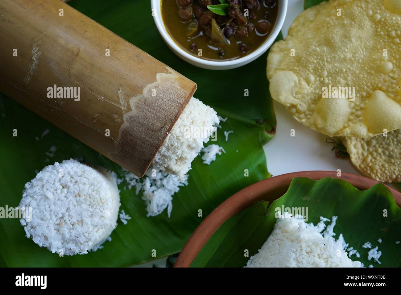 Kerala breakfast rice Puttu /Pittu made in bamboo mould served with ...
