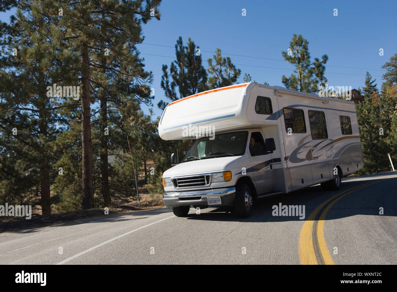RV Driving on Mountain Road Stock Photo - Alamy