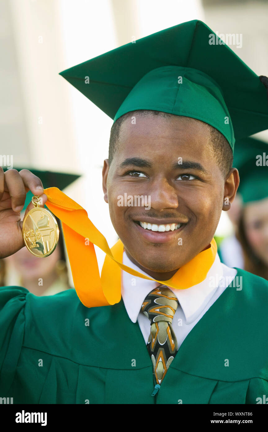 Graduate Holding Medal Stock Photo - Alamy