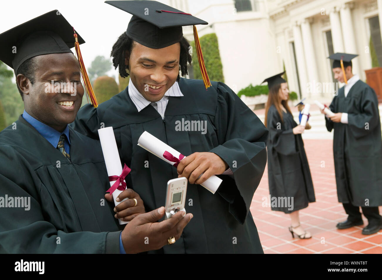 Two graduation hats hi-res stock photography and images - Alamy