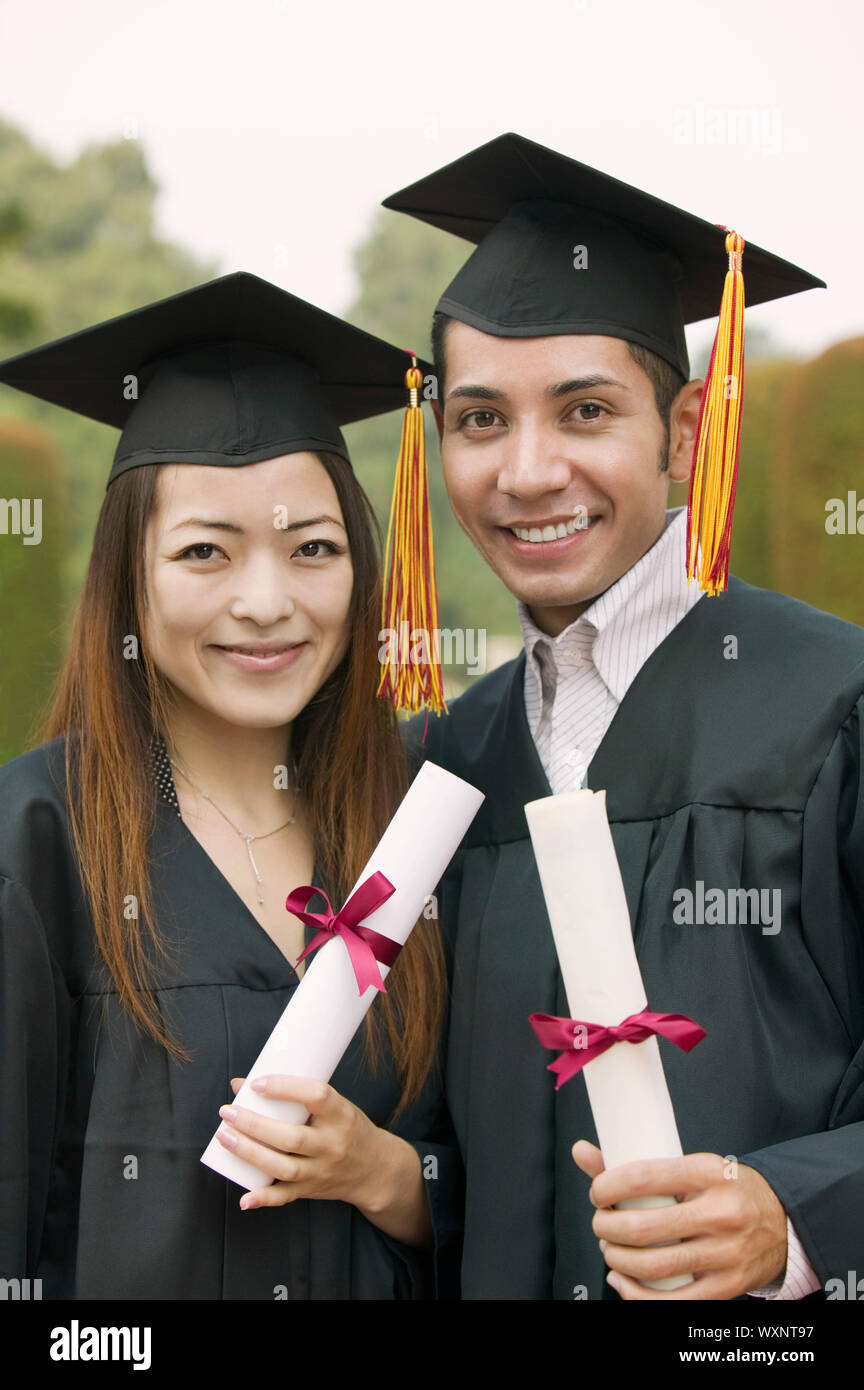 Graduates Holding Diplomas Stock Photo - Alamy