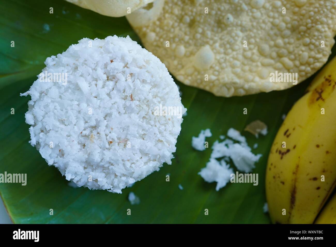 Kerala breakfast white rice puttu made in bamboo mould with Papad and ...