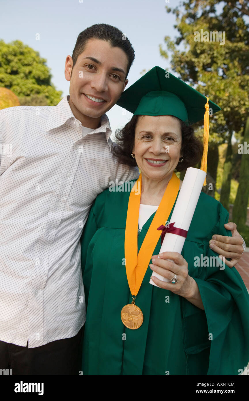 Graduate Mother with Son Stock Photo - Alamy