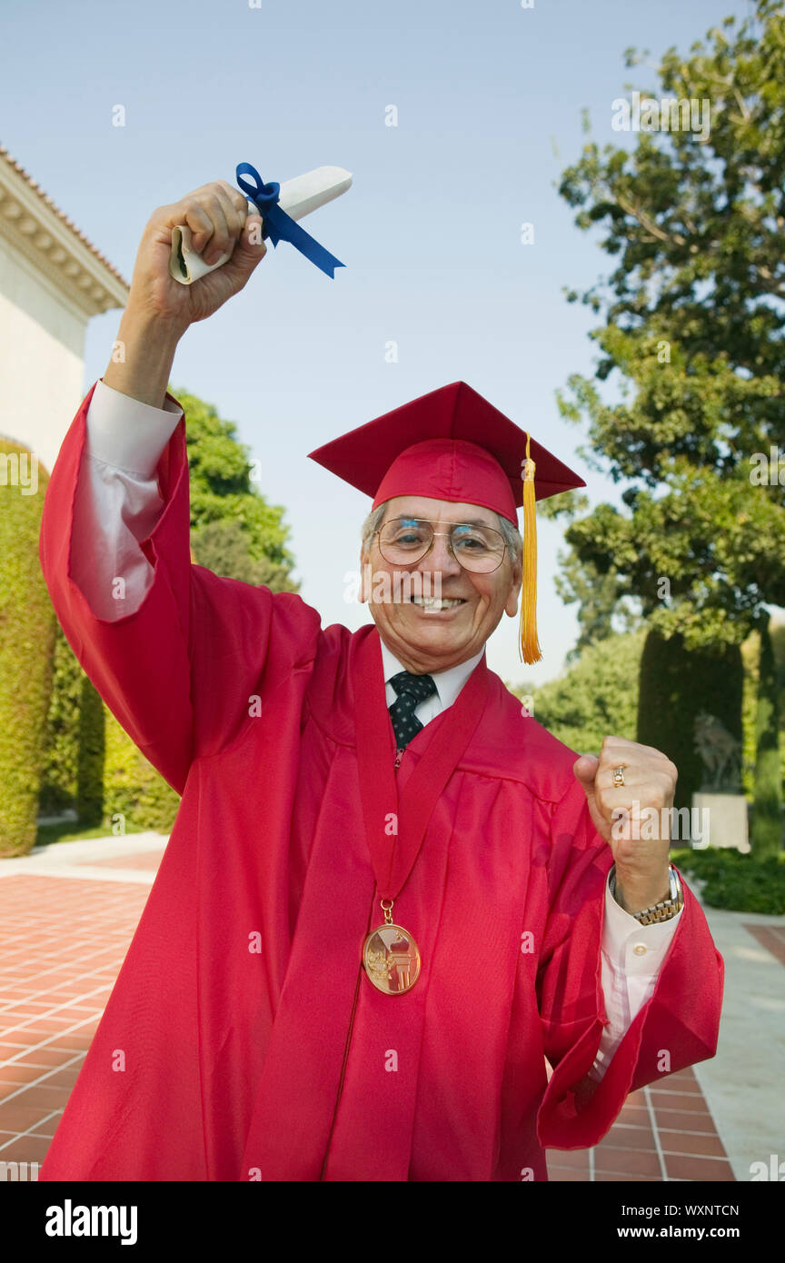 Excited Senior Graduate with Diploma Stock Photo - Alamy