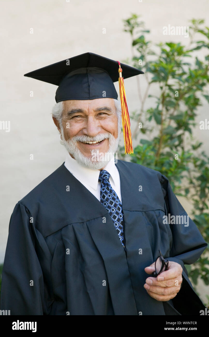 Senior Man in Graduation Gown Stock Photo - Alamy