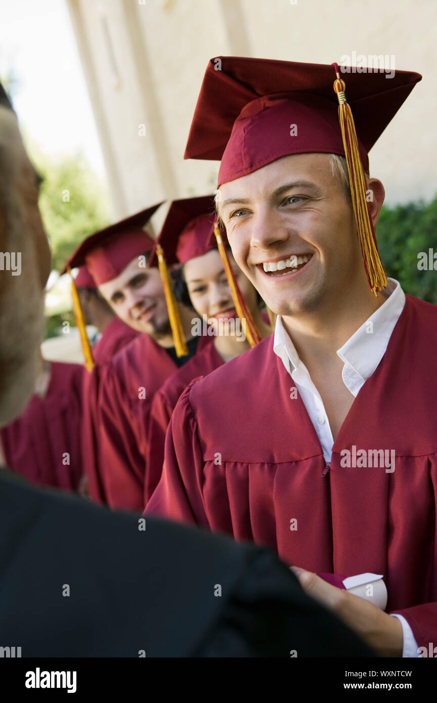 Graduate Receiving Diploma Stock Photo - Alamy