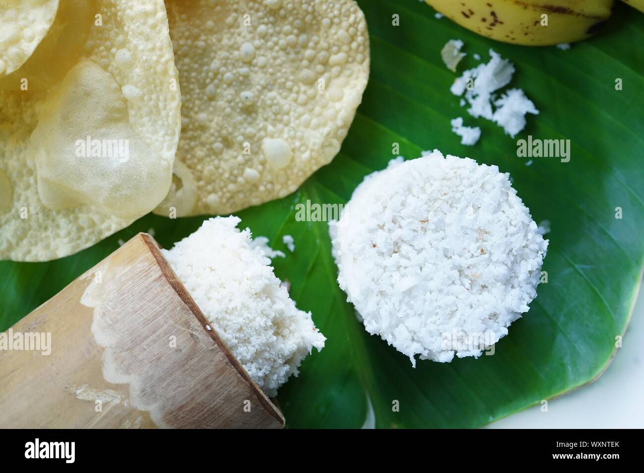 Kerala breakfast white rice puttu made in bamboo mould with Papad and ...