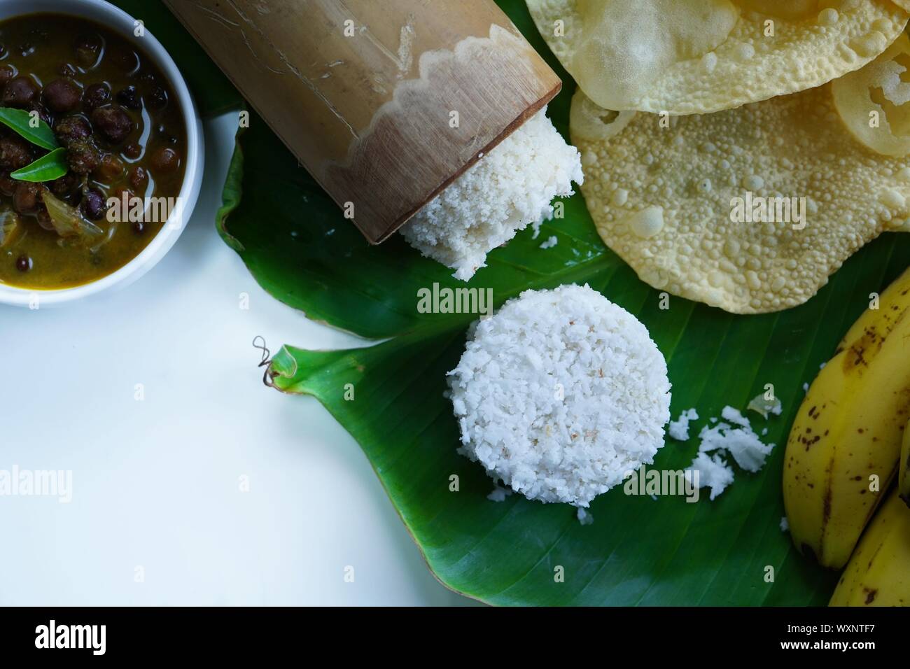 Kerala breakfast rice Puttu /Pittu made in bamboo mould served with ...
