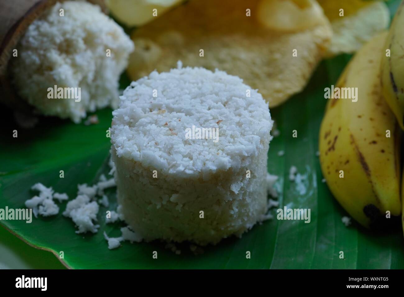 Kerala breakfast white rice puttu made in bamboo mould with Papad and ...