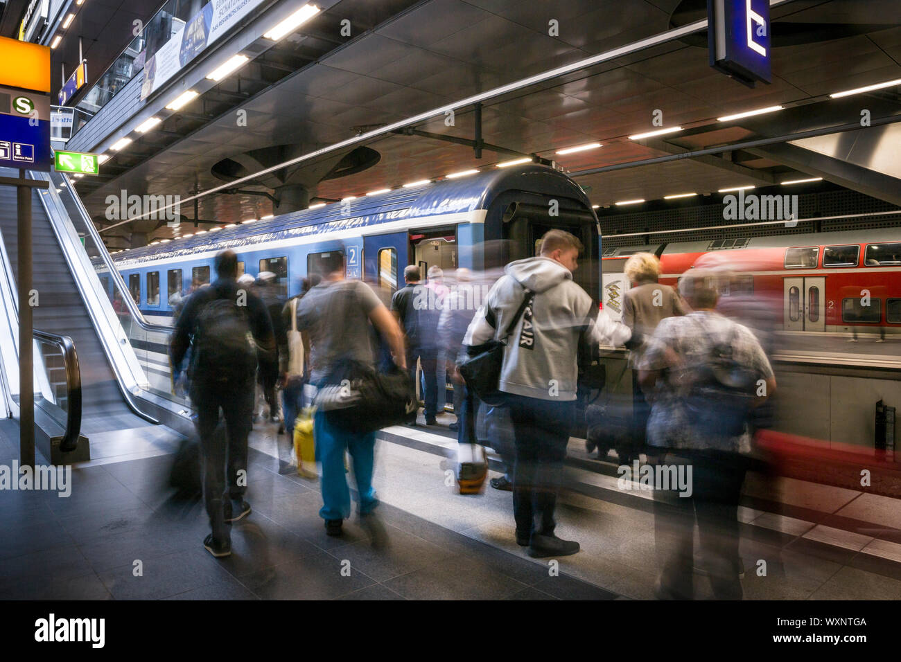 Passengers boarding a train inside the main train station (Hauptbahnhof ...