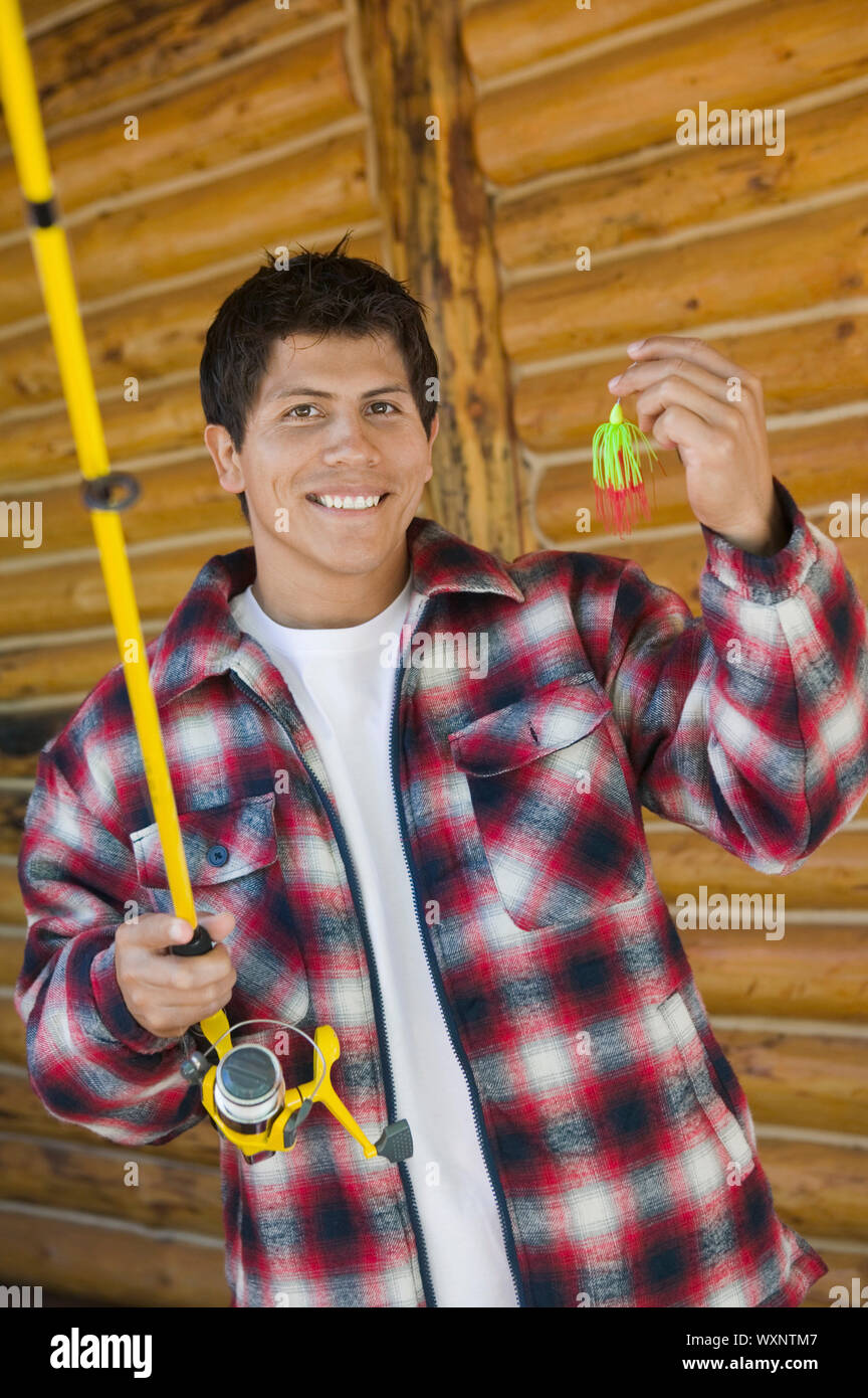 Man with Fishing Rod and Lure Stock Photo - Alamy