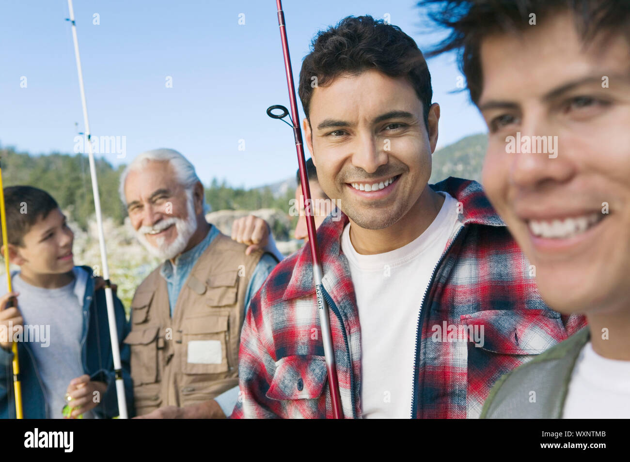 Young guys fishing hi-res stock photography and images - Alamy