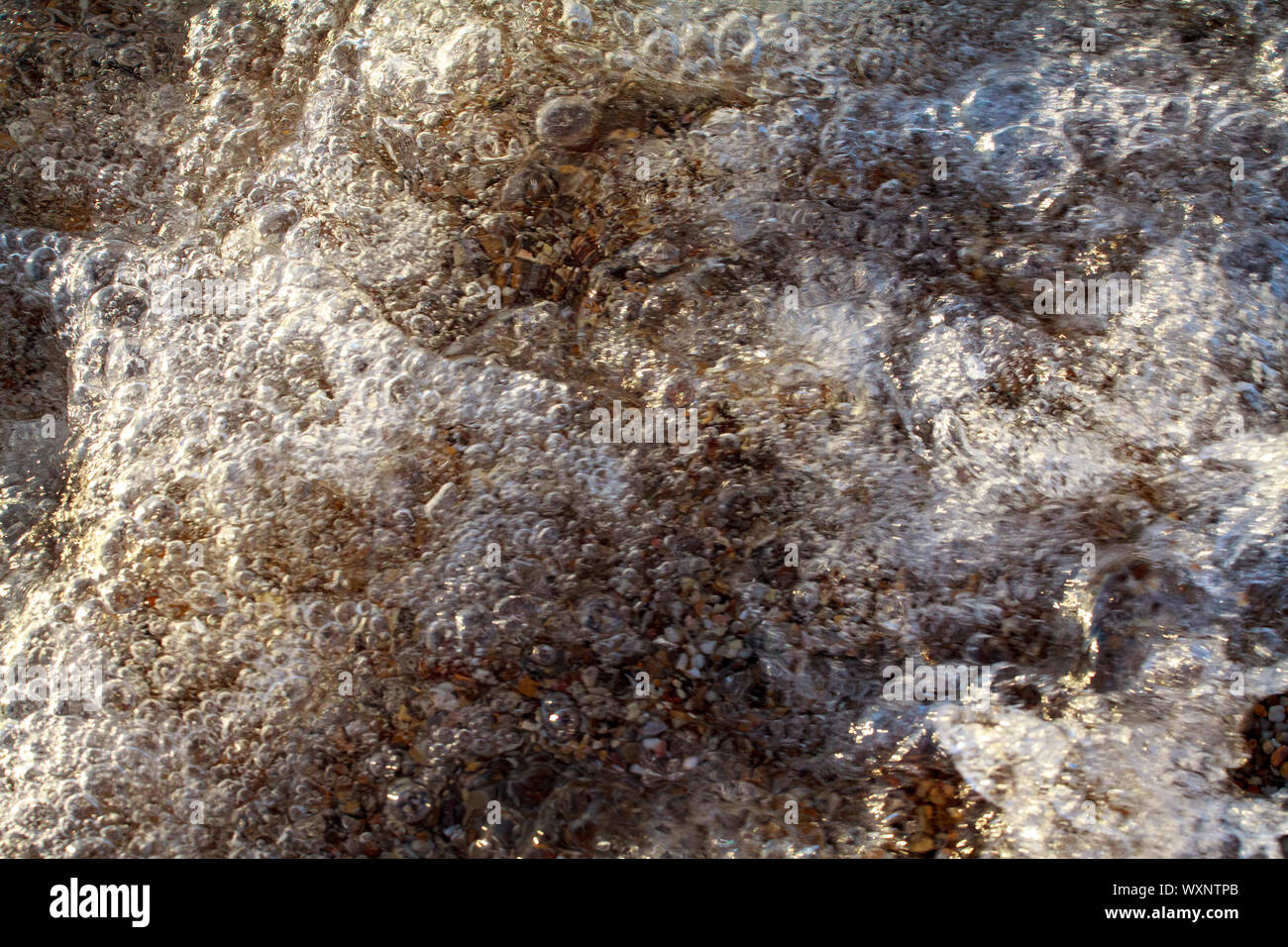 sea pebbles colored granite on the beach background stones. The shore ...