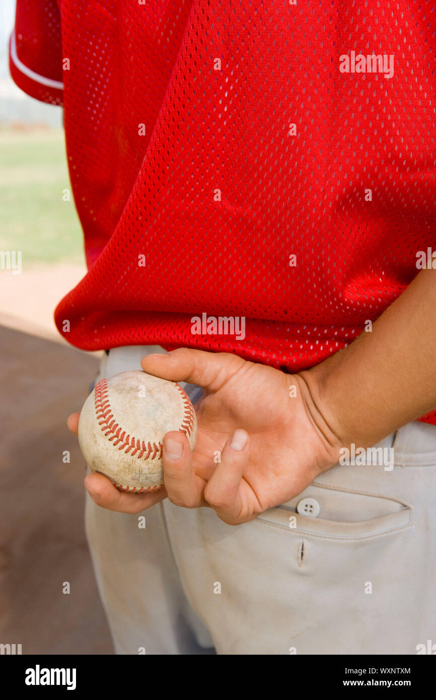 Pitcher Holding Baseball Behind His Back Stock Photo - Alamy